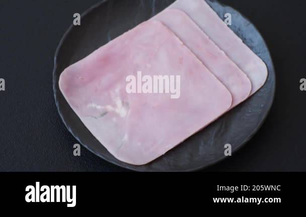 Ham cut into square slices for making delicious nutritious sandwiches ...