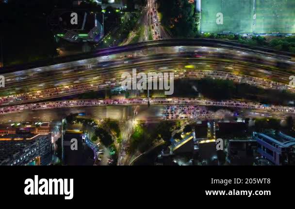 Aerial timelapse of evening traffic on multi-lane road during rush hour ...