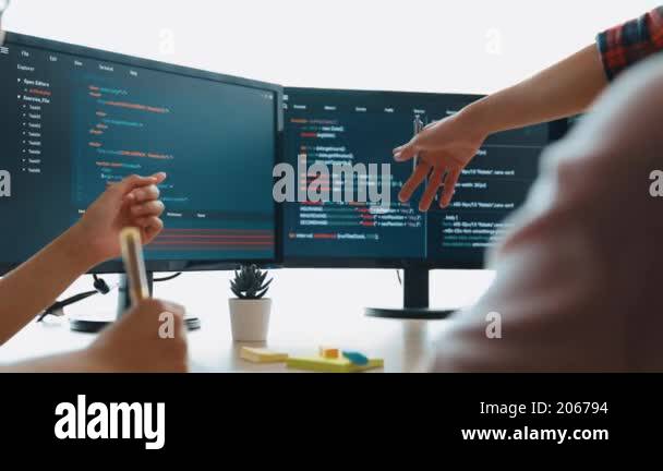 Slow motion back end software developer engineer for computer programming working together on ...