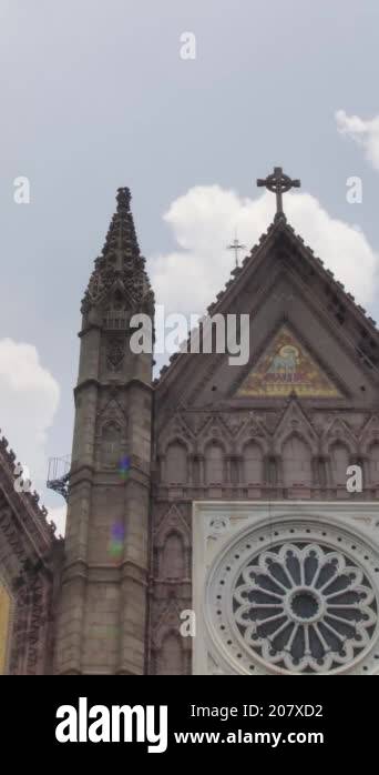 Upper part of a facade of a Gothic style church, with towers ...