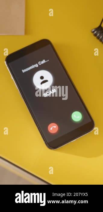 Vertical video. A woman is woken up by a call from scammers, she hangs ...