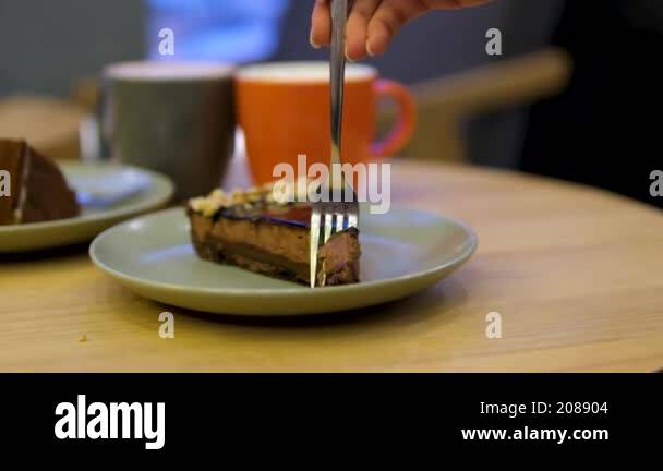 Biting a delicious piece of chocolate cake. Eating chocolate cake ...