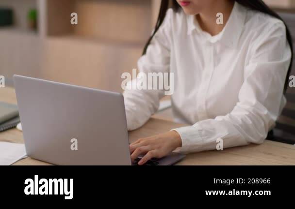 Concentrated focused Asian Korean business woman female professional ...