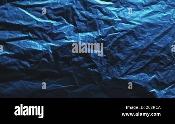 Blur creased foil. Scratched texture. Defocused blue black color shiny ...