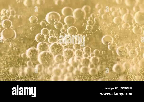 Bubble emulsion. Oil liquid. Blur golden color shiny air sphere texture ...