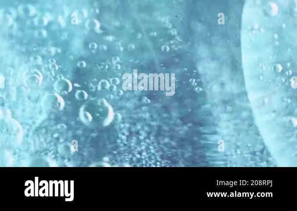 Water bubbles. Oil fluid. Defocused clear blue color fluid swirl wet ...