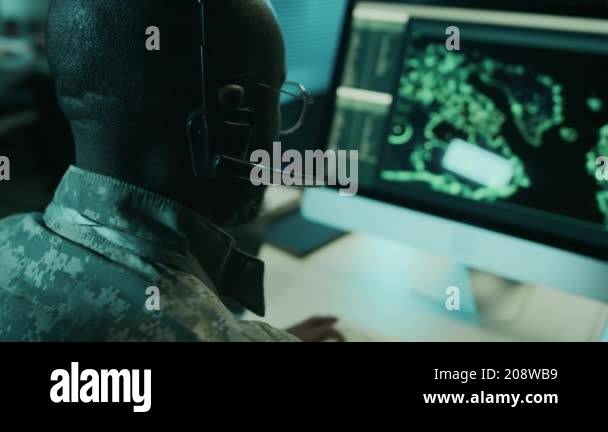 Closeup over-shoulder shot of African American male officer in ...