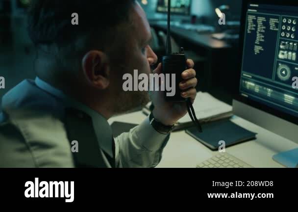 Side closeup of busy Caucasian male intelligence officer in uniform ...