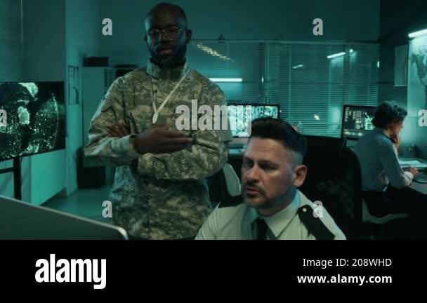 Medium shot of African American male army field commander in camouflage ...