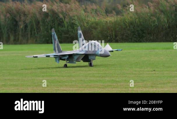Padua Italy October 6 2024: RC model of a modern jet aligns on a grassy ...