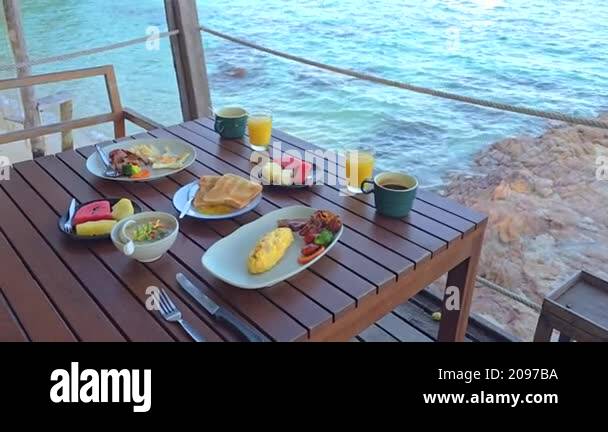 Savor a delightful breakfast spread featuring fresh tropical fruits, an ...