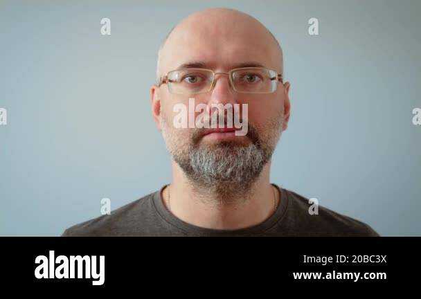 Funny bald man chewing dumplings with silly expression. Bald male ...