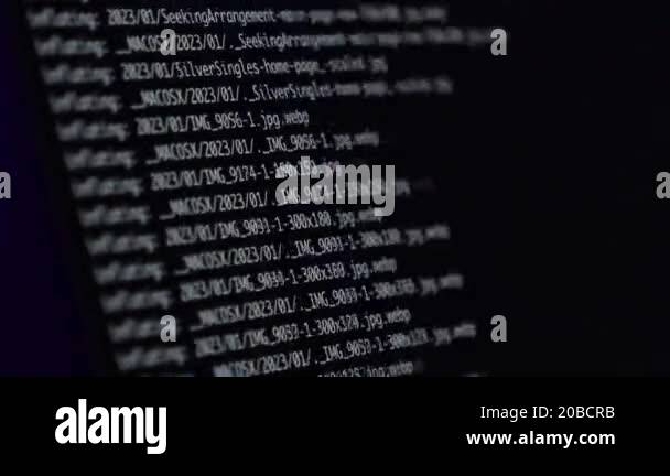 lines of code moving rapidly on a dark screen with a zoom effect ...