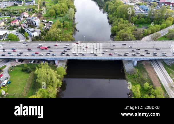 Aerial view of a busy highway bridge over a river, surrounded by ...