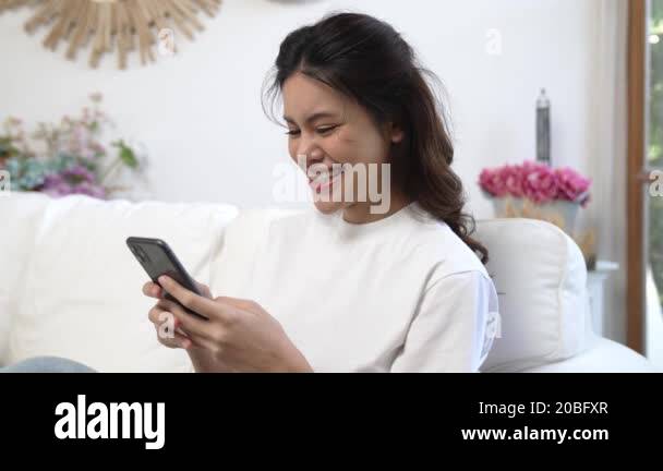 Young woman using smartphone browsing for online shopping E commerce by ...