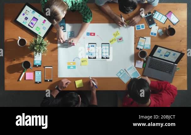 Professional developer team sharing idea of Ux Ui design by using mind map. Top down view of ...