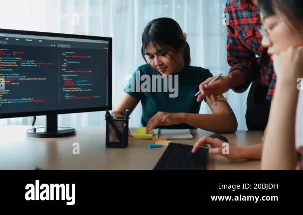 Slow motion back end software developer engineer for computer programming working together on ...