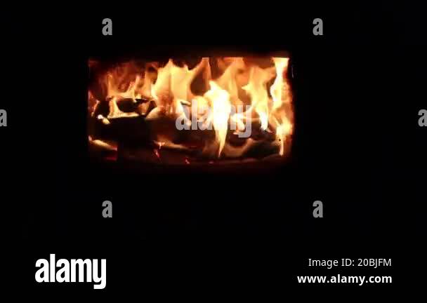 A stunning view of flames dancing in a cozy fireplace, creating a warm ...