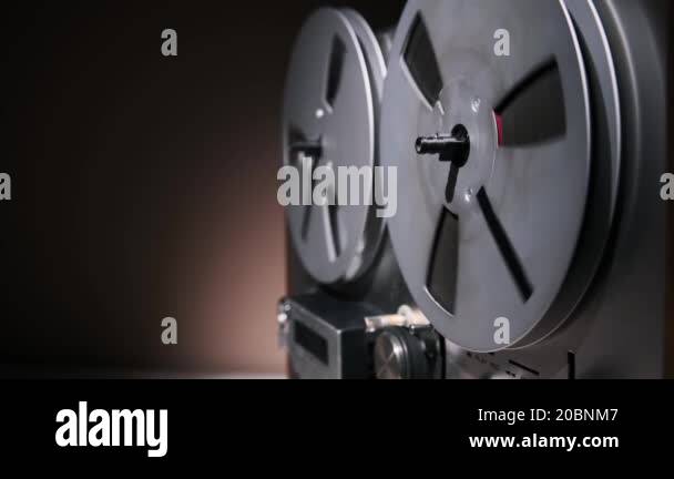 Detailed view of the rotating spools on a vintage analog tape machine ...