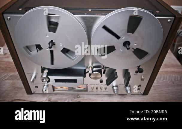 A top-down perspective of a vintage reel-to-reel tape recorder with ...