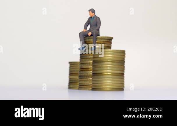 360-degree video displaying a miniature businessman in a suit sitting ...