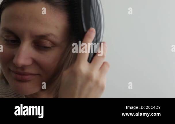 Young woman with static electricity on her natural short hair after ...