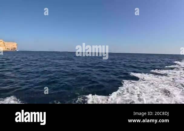 A close-view of Tidal waves captured from the boat over the deep blue ...