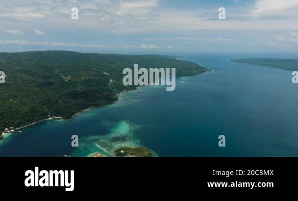 Top view of tropical island with green mountain and blue sea, sky and ...