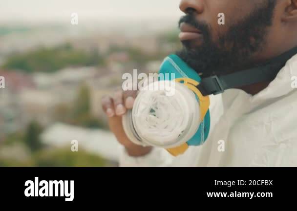 Pandemic. Quarantine. Alert african man virologist wearing respirator ...