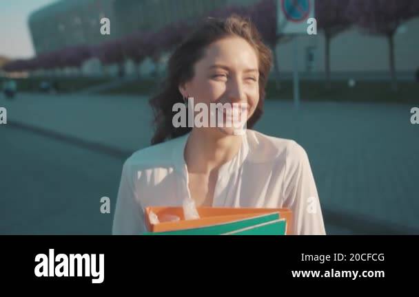 Inspired business woman quitting job feel happy leaving office. Portrait satisfied girl ...