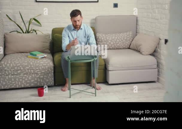 Upset businessman getting bad news on laptop at home internet remote ...