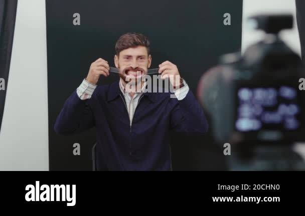 Portrait young handsome man sitting look show teeth dentis takes ...