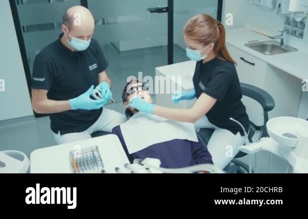 NEW YORK - April 5, 2020: Close up man at work as dentist with ...
