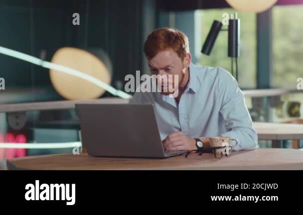 Handsome happy ginger business person talking on webcam video ...