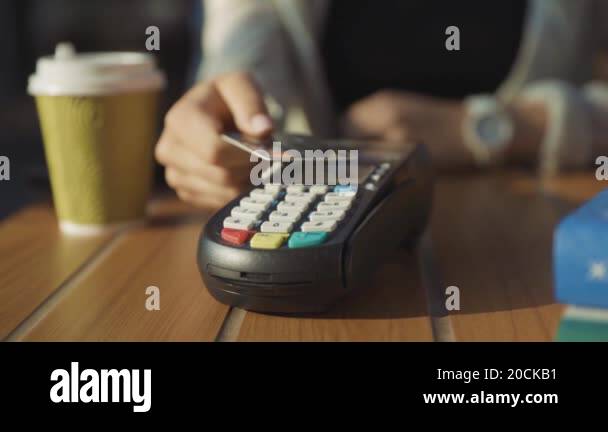 NEW YORK - June 15, 2019: Close-up of woman rotating credit card in ...