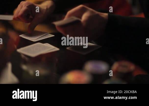 Close up view of male dealers hands distributing for table poker three ...