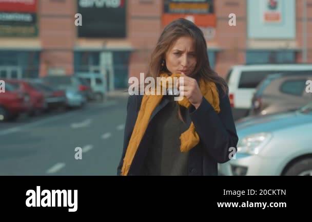 Close up young woman walk coughs feel sick at outdoor fever cold ...