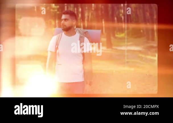 Portrait retro filter handsome young man hiker standing in the forest ...