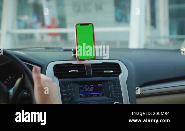 NEW YORK - May 19, 2019: Hands woman drive car use phone with vertical ...
