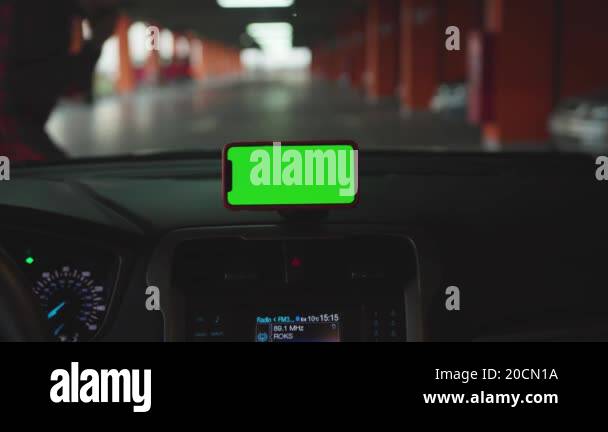 NEW YORK - April 5, 2019: Hands man drive car smartphone with ...