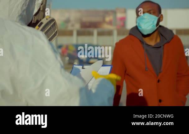 Screening of passengers travellers african american man Covid-19 ...