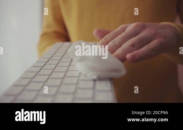 Handheld shot of man cleaning computer devices. Close-up guy ...