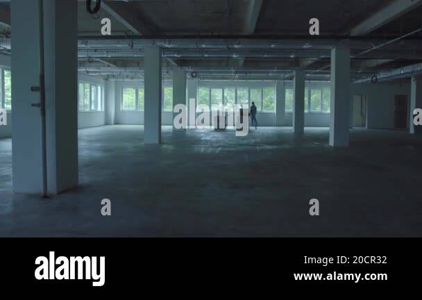 Close up white hall walls woman standing building interior deserted old ...