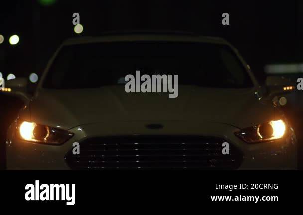 Close up view of blinking turn lights signals of luxurious modern white ...