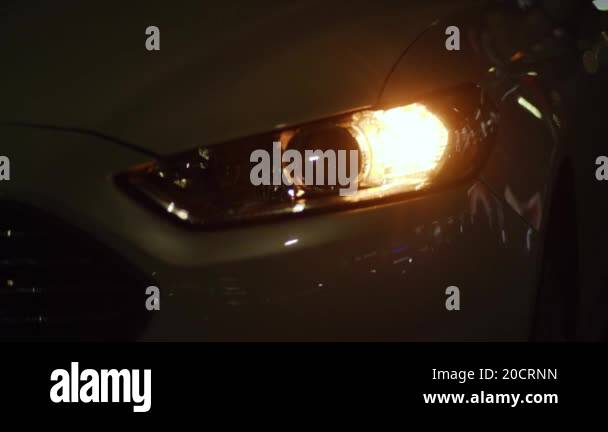 Close up view of blinking turn signal of white luxurious business class ...
