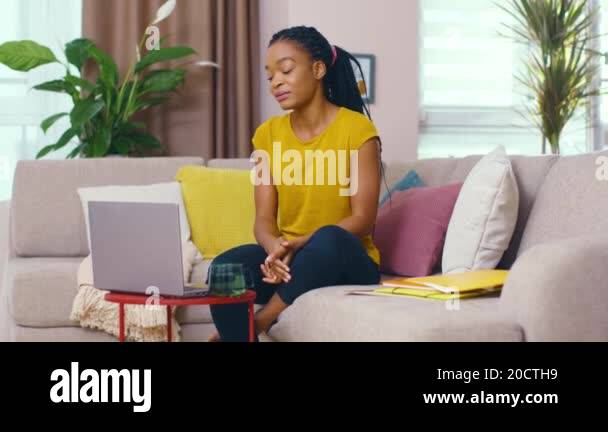 Attractive happy millennial young african woman videochatting with ...