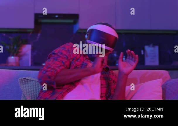 African american man with VR headset playing virtual horror game ...