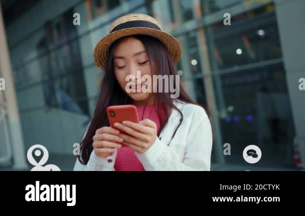 Happy Chinese Young Woman Using Mobile Phone Receiving Popular Social ...