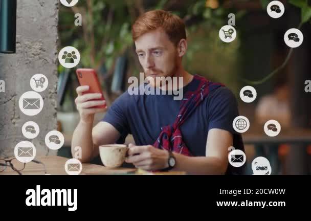 Joyful caucasian ginger businessman using cellular phone social ...