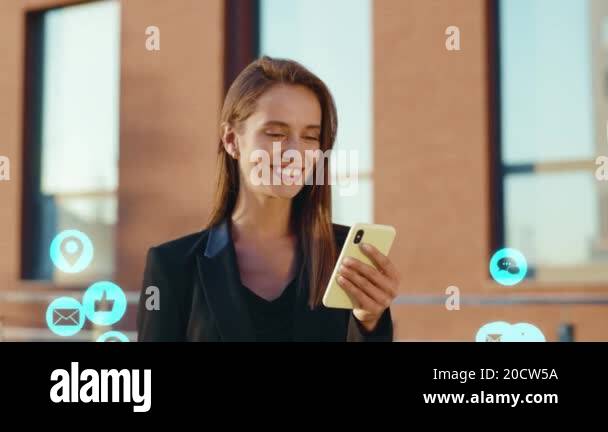 Beautiful young woman use phone look at camera smile. Stand on street ...